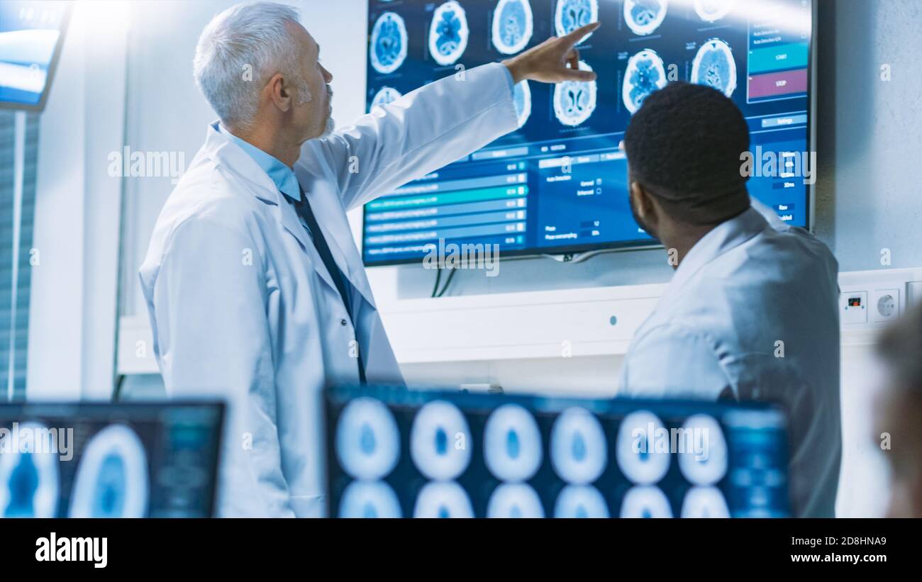 Team of Scientists Work in the Brain Research Laboratory, Discussing ...