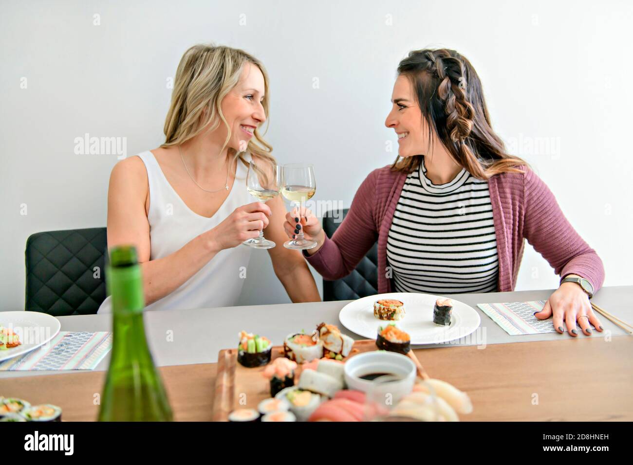 A Group of attractive mature people eating sushi at home Stock Photo ...
