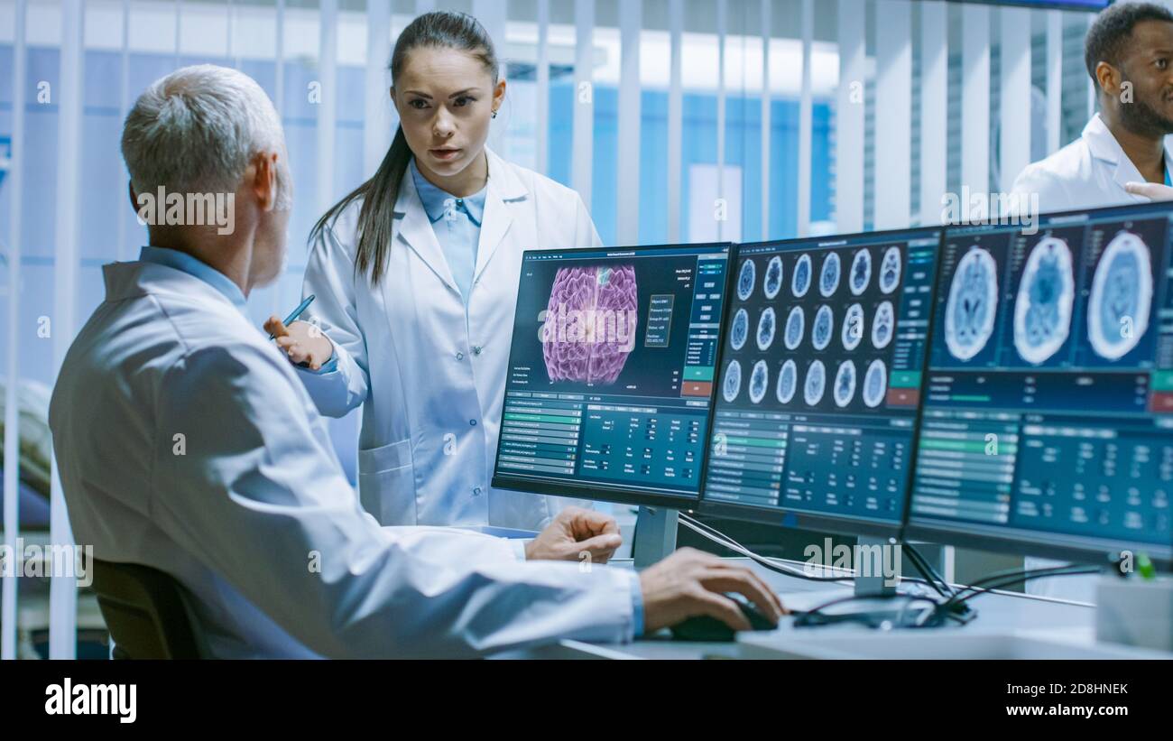 Two Medical Scientists in the Brain Research Laboratory Discussing ...