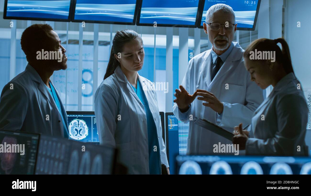 Diverse medical colleagues having conversation hi-res stock photography ...