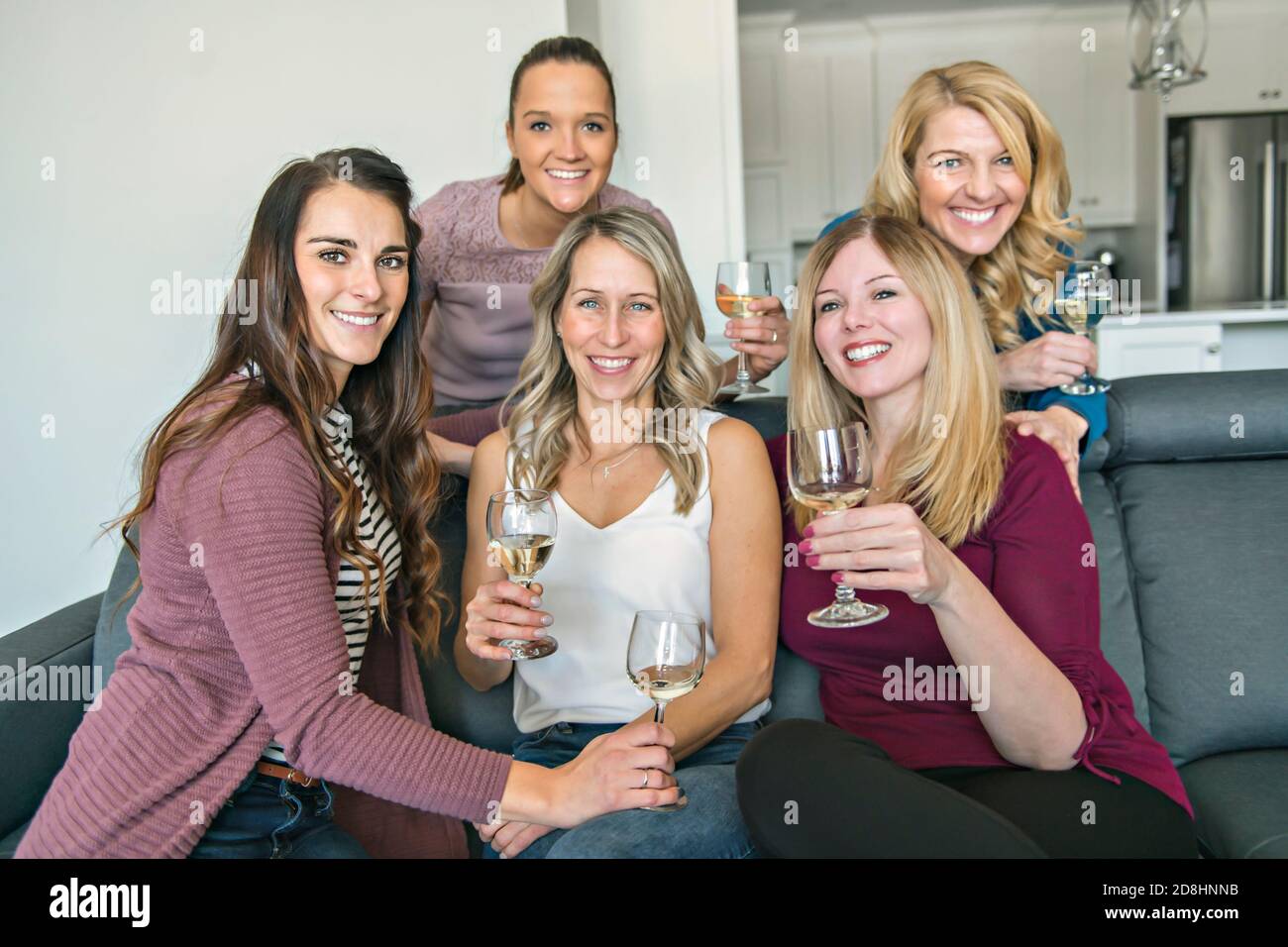 Five young women toast and celebrating their meeting Stock Photo - Alamy