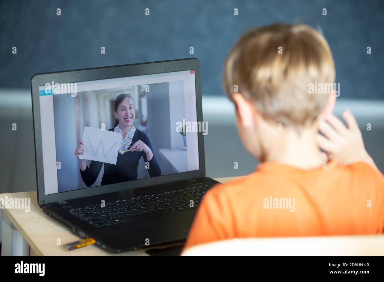 The remote teacher speaks via video link with the student. Online ...