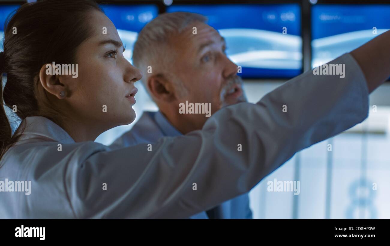 Close-up Shot of Two Medical Scientists Neurologists, Talking and ...