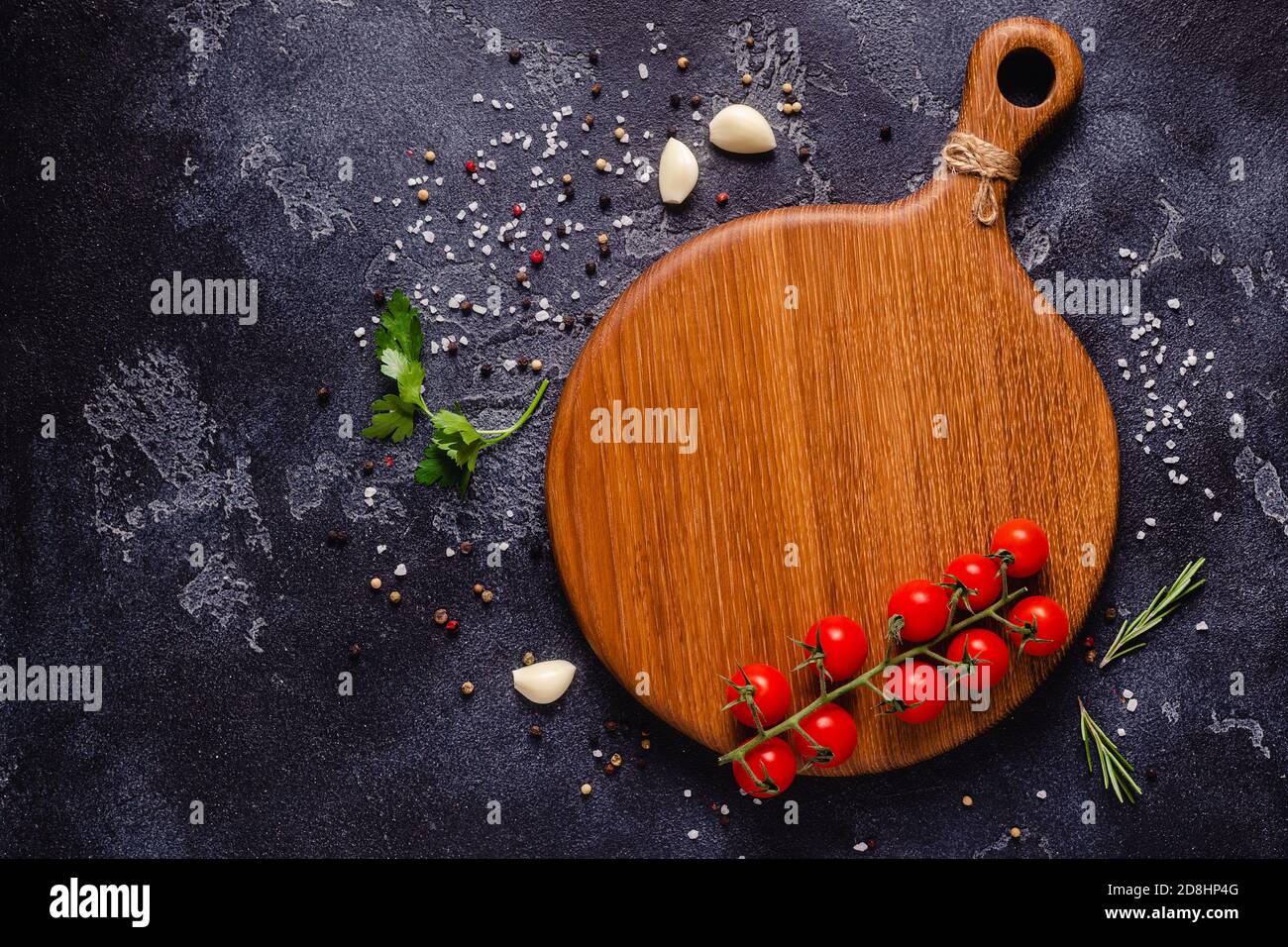 Herbs and condiments on black stone background. Top view with copy ...