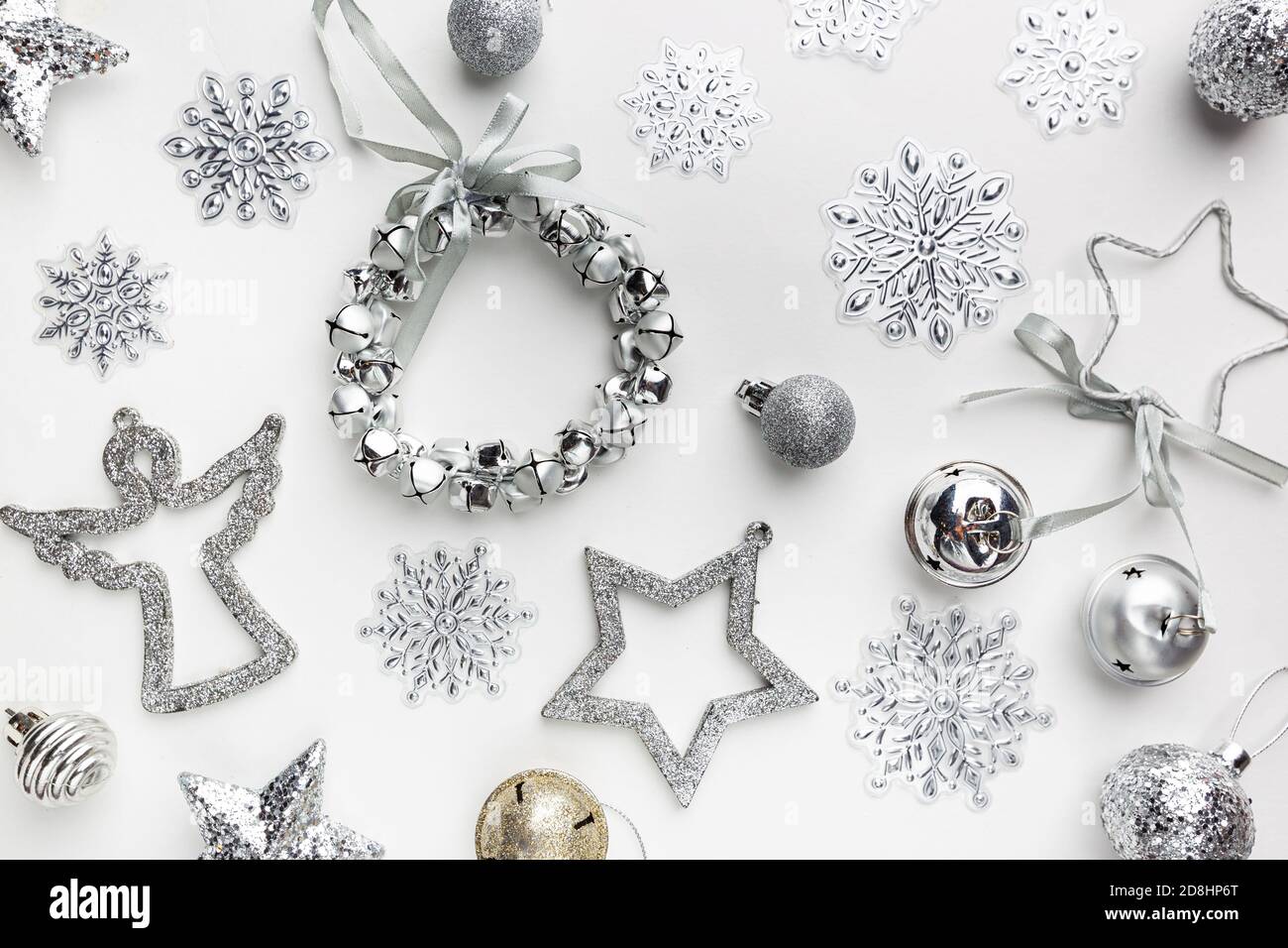 Christmas round composition made of silver winter decorations on white ...