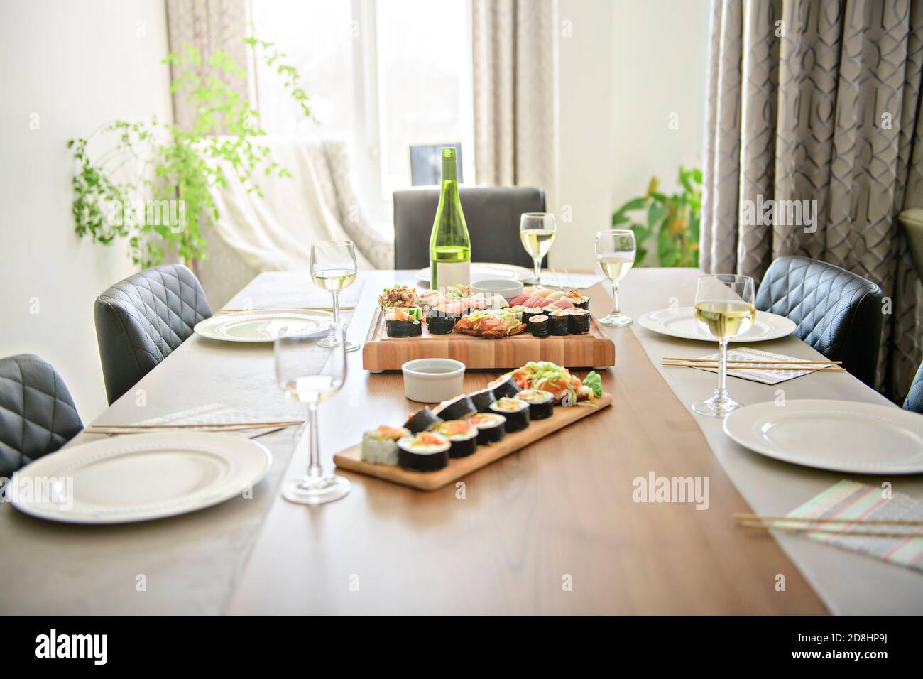 A Table dinner with traditional sushi dishes and drinks Stock Photo - Alamy