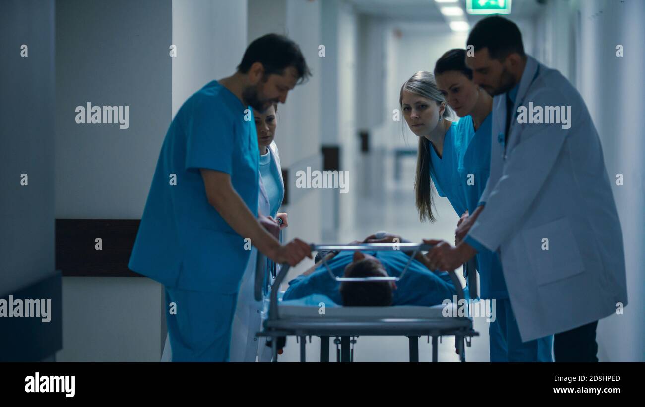 Emergency Department: Doctors, Nurses and Paramedics Push Gurney ...