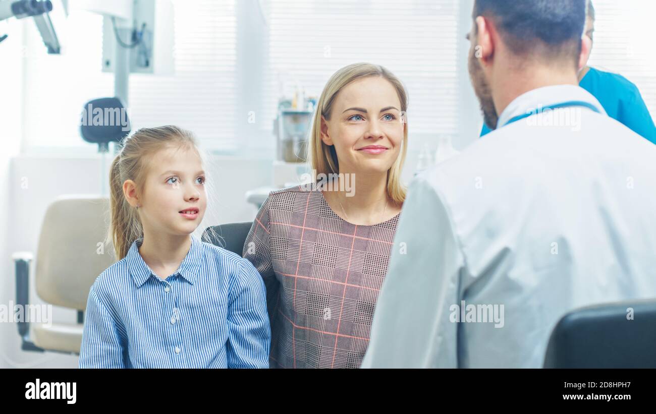 Mother with Sweet Little Girl Visit Friendly Pediatrician. Doctor Talks ... Mother with Sweet Little Girl Visit Friendly Pediatrician. Doctor Talks ...