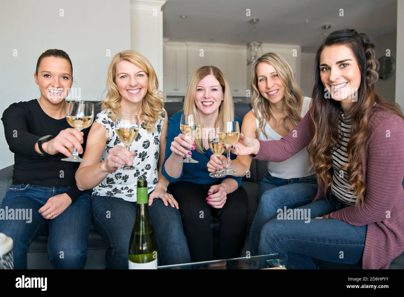 Five young women toast and celebrating their meeting Stock Photo - Alamy