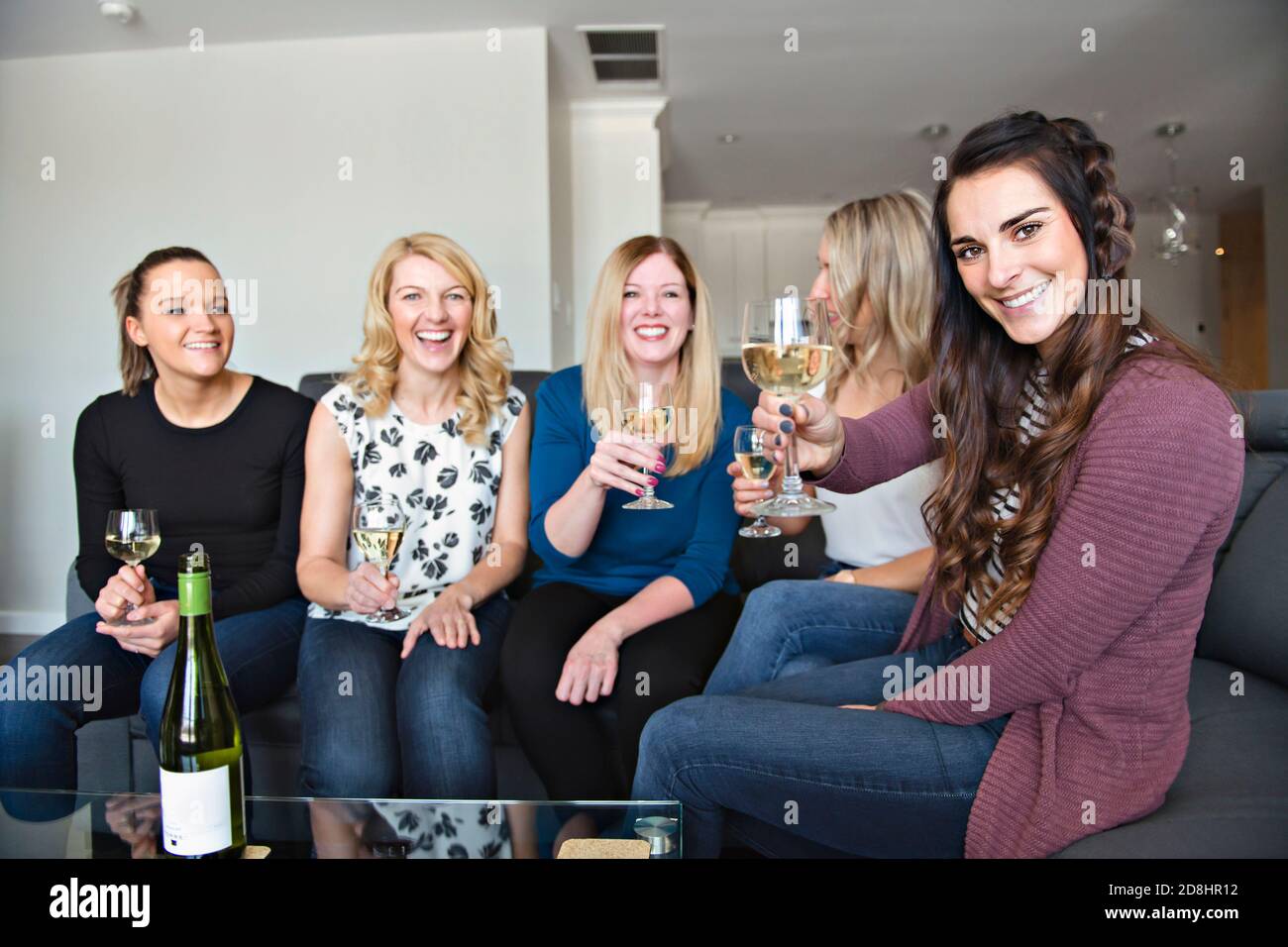 Five young women toast and celebrating their meeting Stock Photo - Alamy