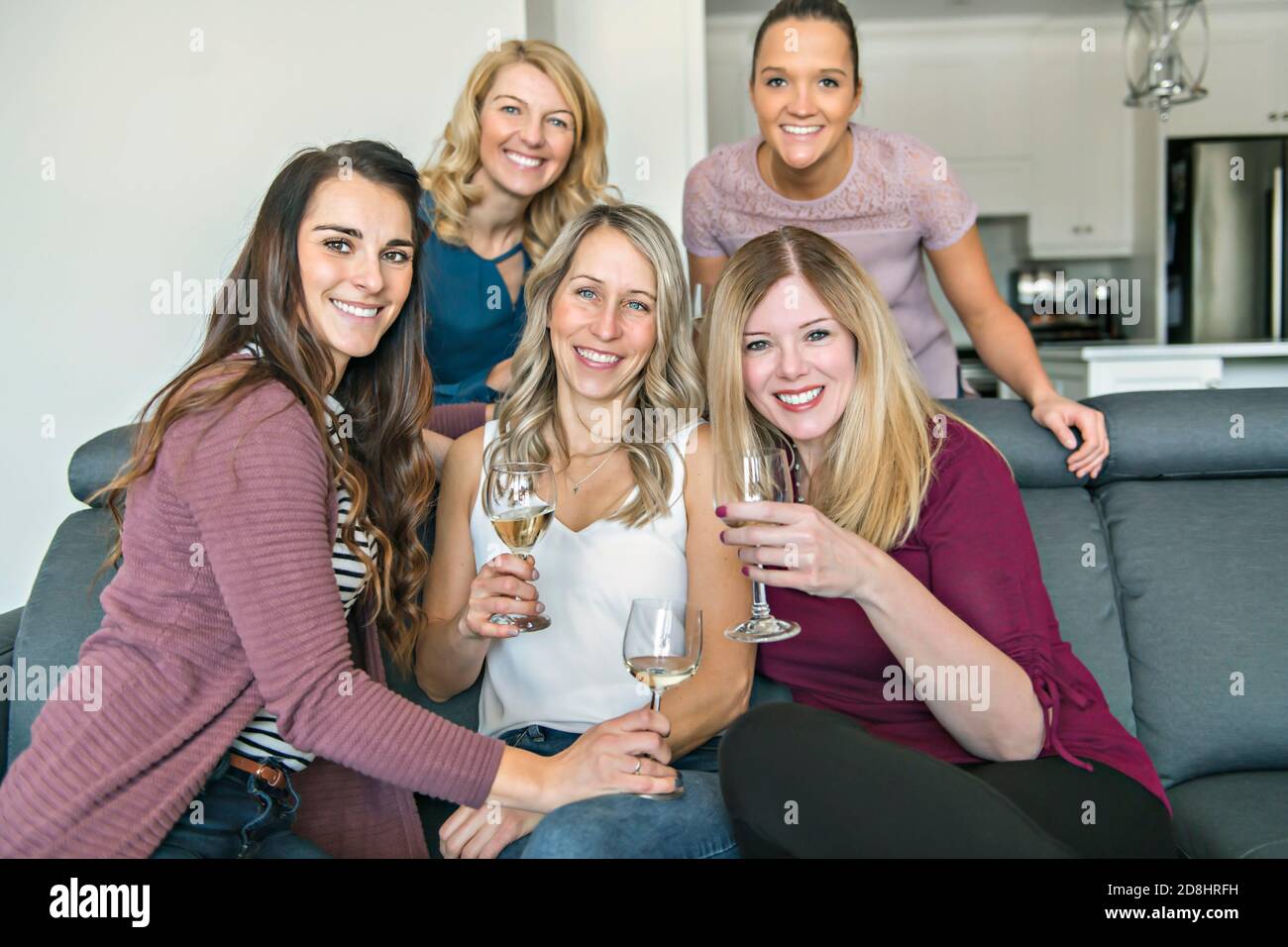 Five young women toast and celebrating their meeting Stock Photo - Alamy