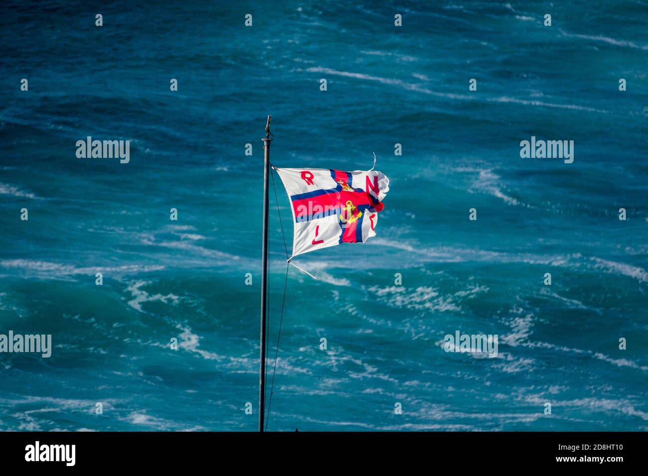 RNLI Flag, sea, waves Stock Photo - Alamy