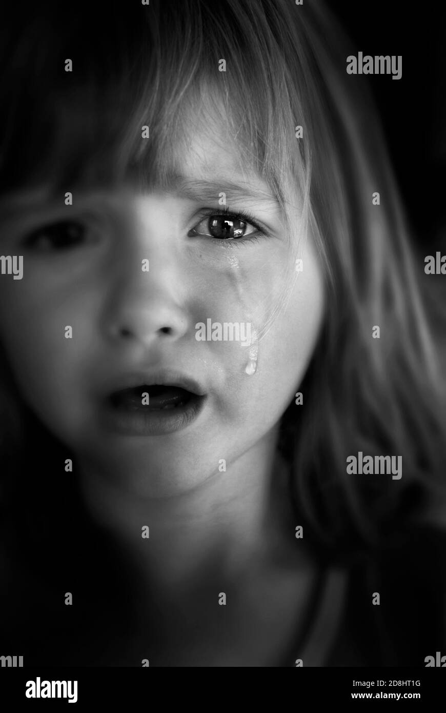 Portrait of little girl crying with tears rolling down her cheeks dramatic and emotional Stock ...