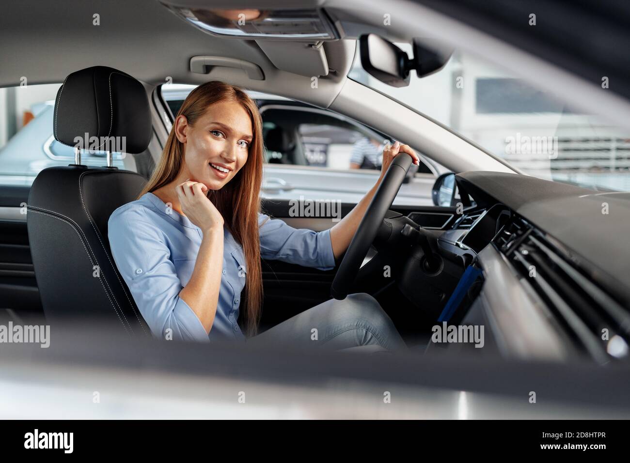 Happy woman new car owner sitting in driver seat Stock Photo - Alamy