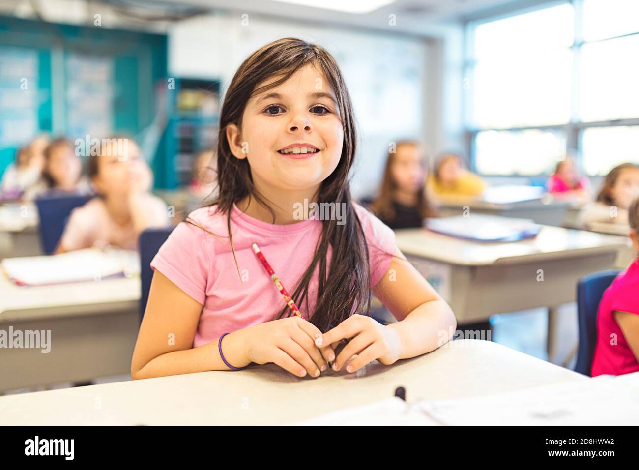 A education and school concept little student girl studying at school ...