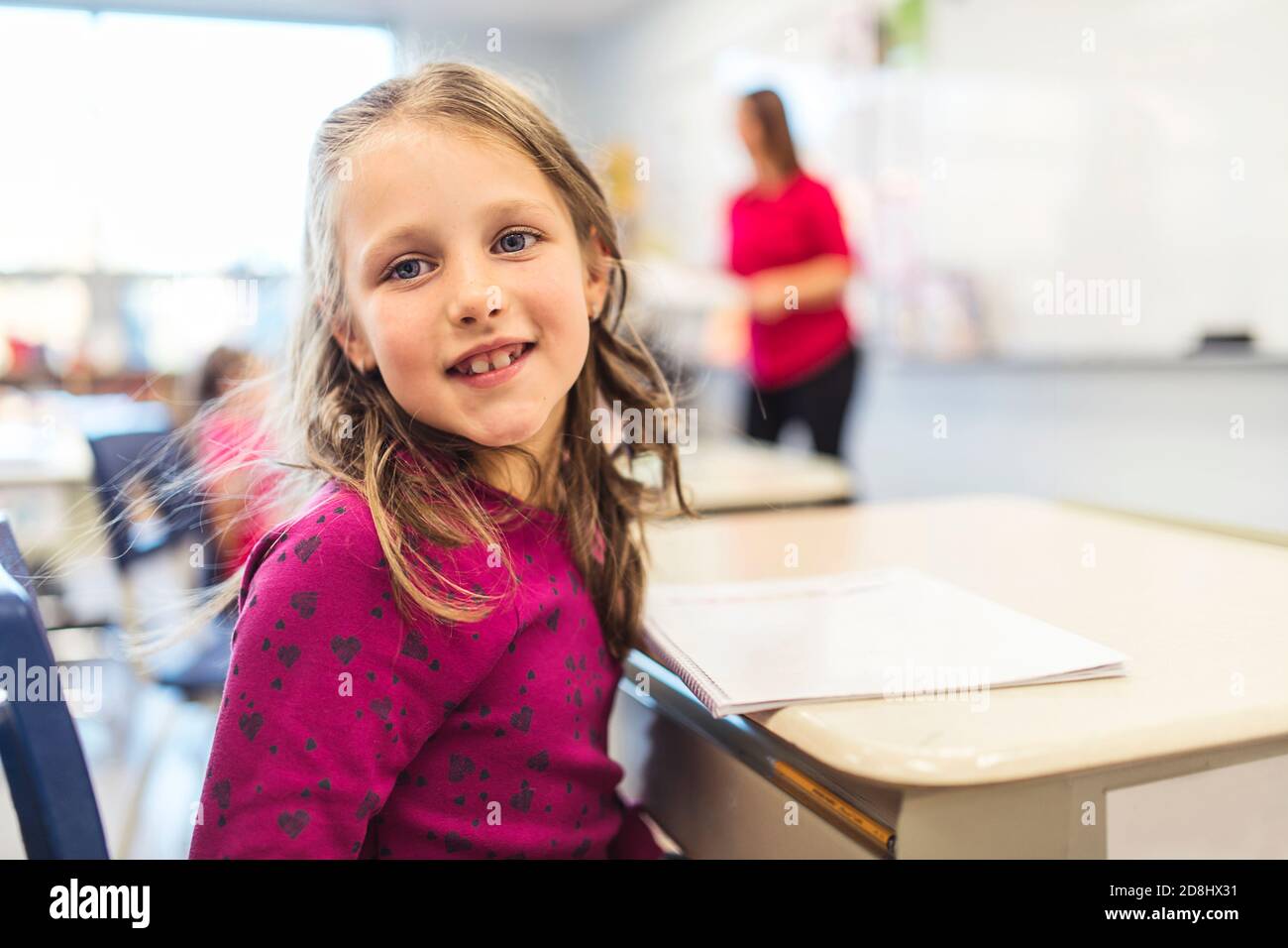 A education and school concept little student girl studying at school ...