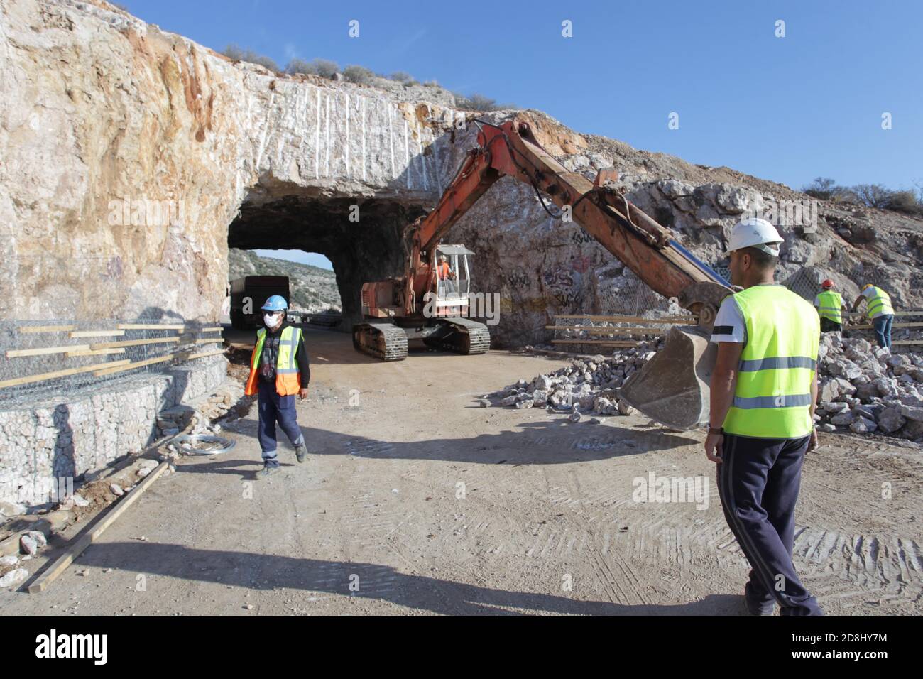 construction workers walk through the open tunnel Stock Photo - Alamy