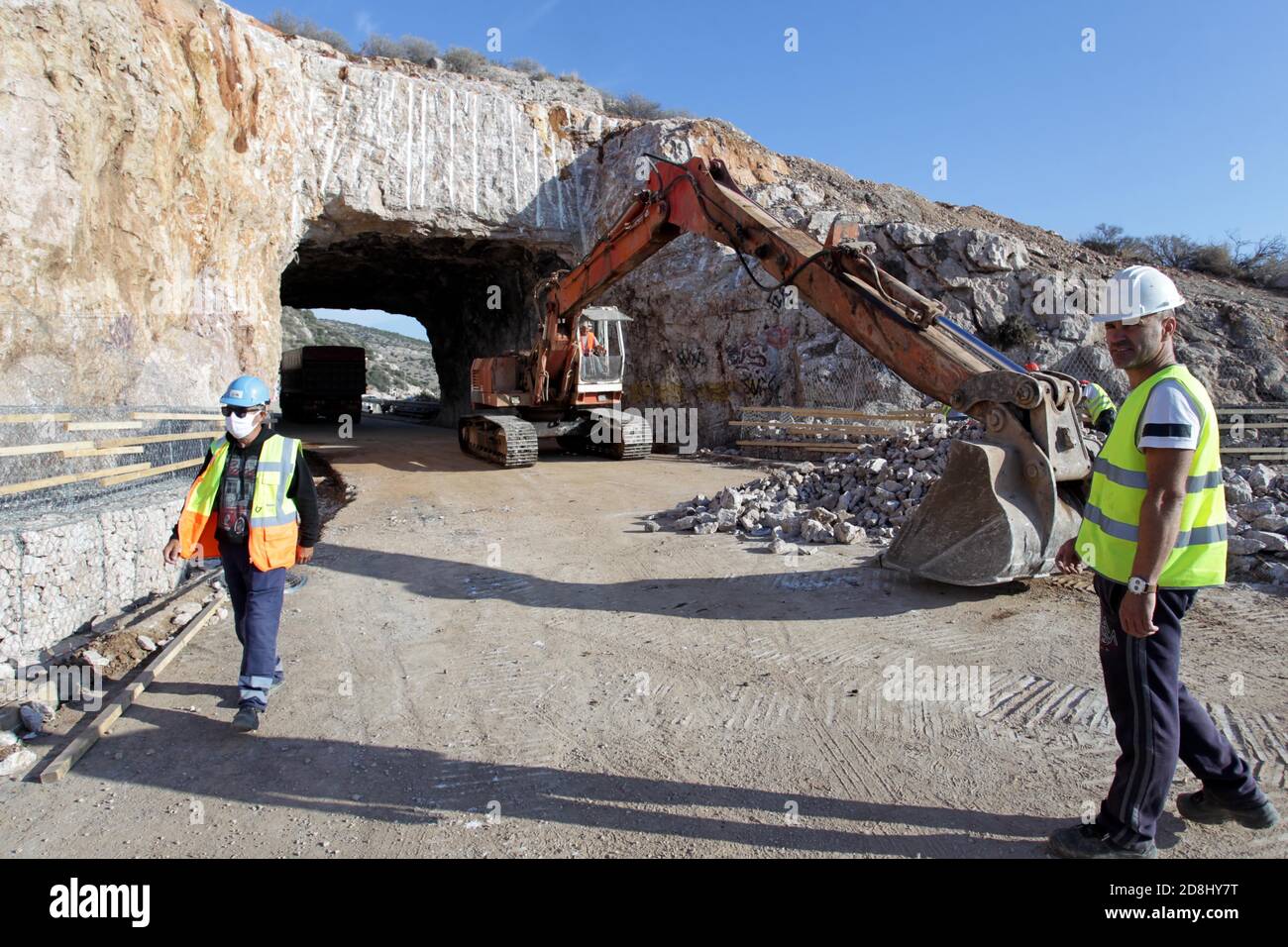 construction workers walk through the open tunnel Stock Photo - Alamy