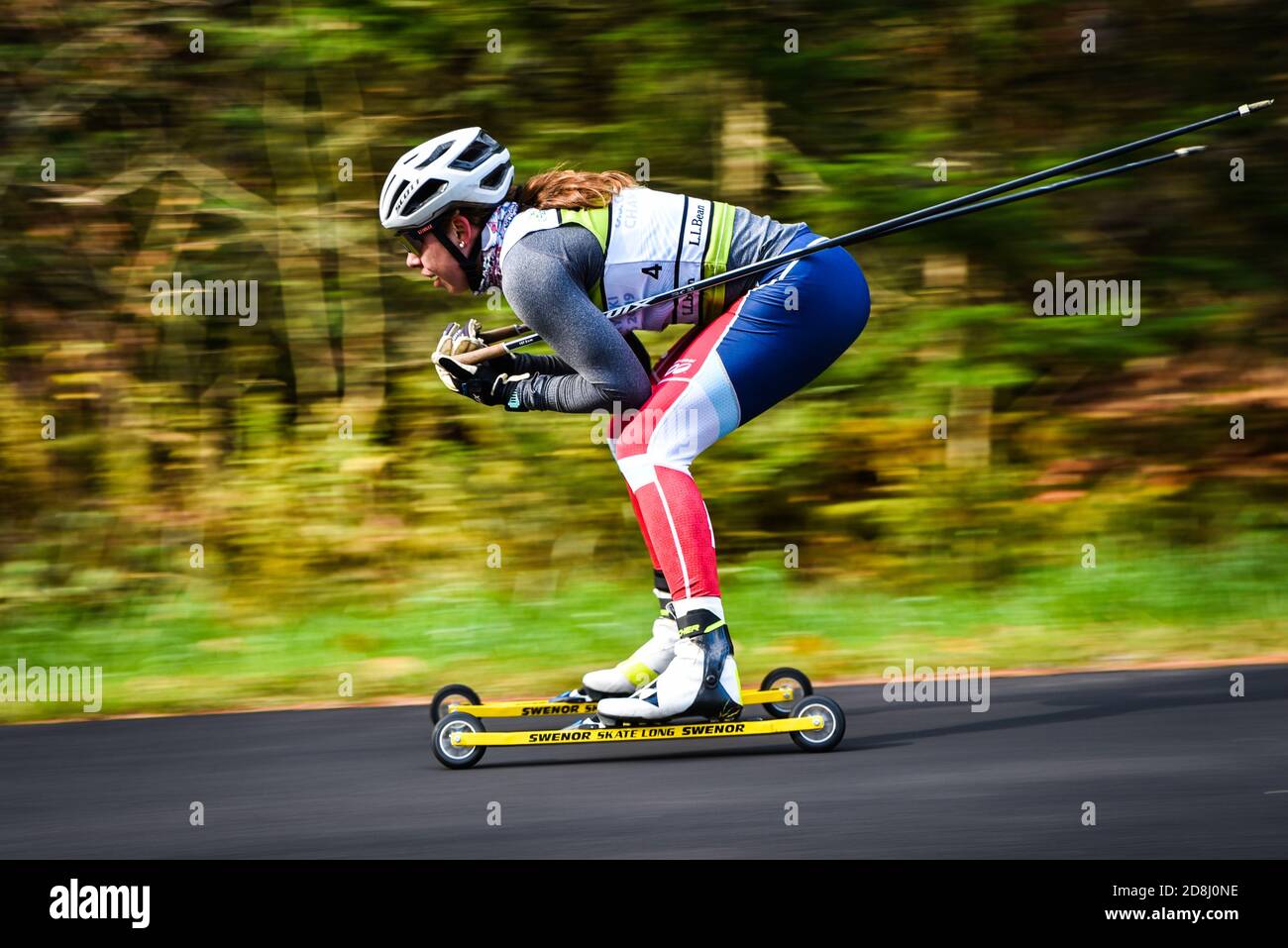 US cross country ski racer Katharine Ogden tucks while racing downhill in a ROLLER SKI RACE ...