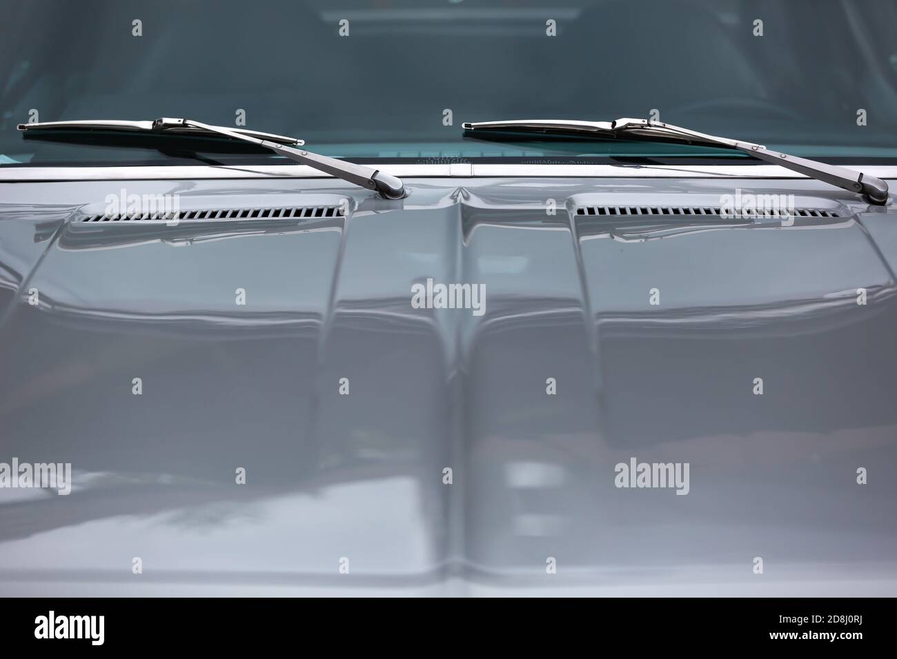 Gray bonnet, glass windshield and windshield wiper of a classic Stock ...