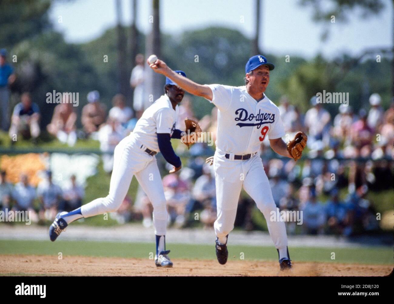 Los Angeles Dodgers Mickey Hatcher throwing the ball as teammate ...
