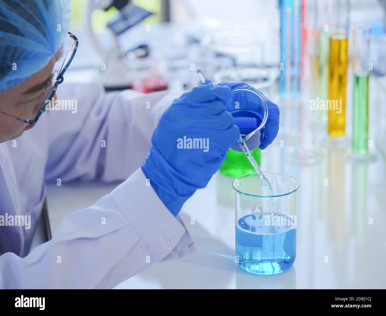 Senior female scientists working in laboratories Preparing to mix two ...
