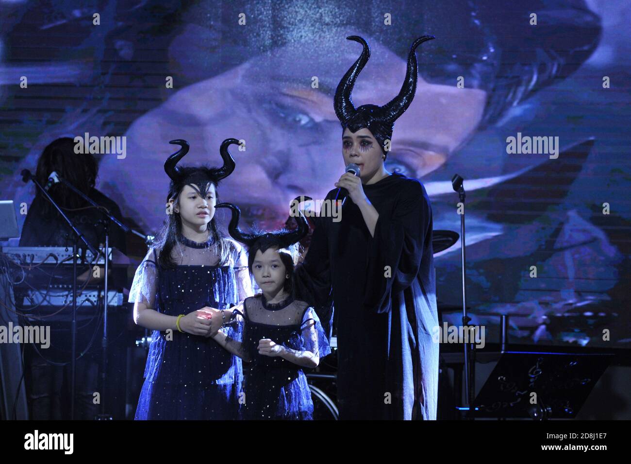 The Filipino rock & roll band, band@work, plays a Halloween show at The ...