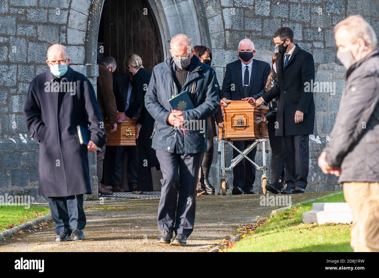 The coffins of Tadhg O'Sullivan and his son Diarmuid, leave St Mary's ...