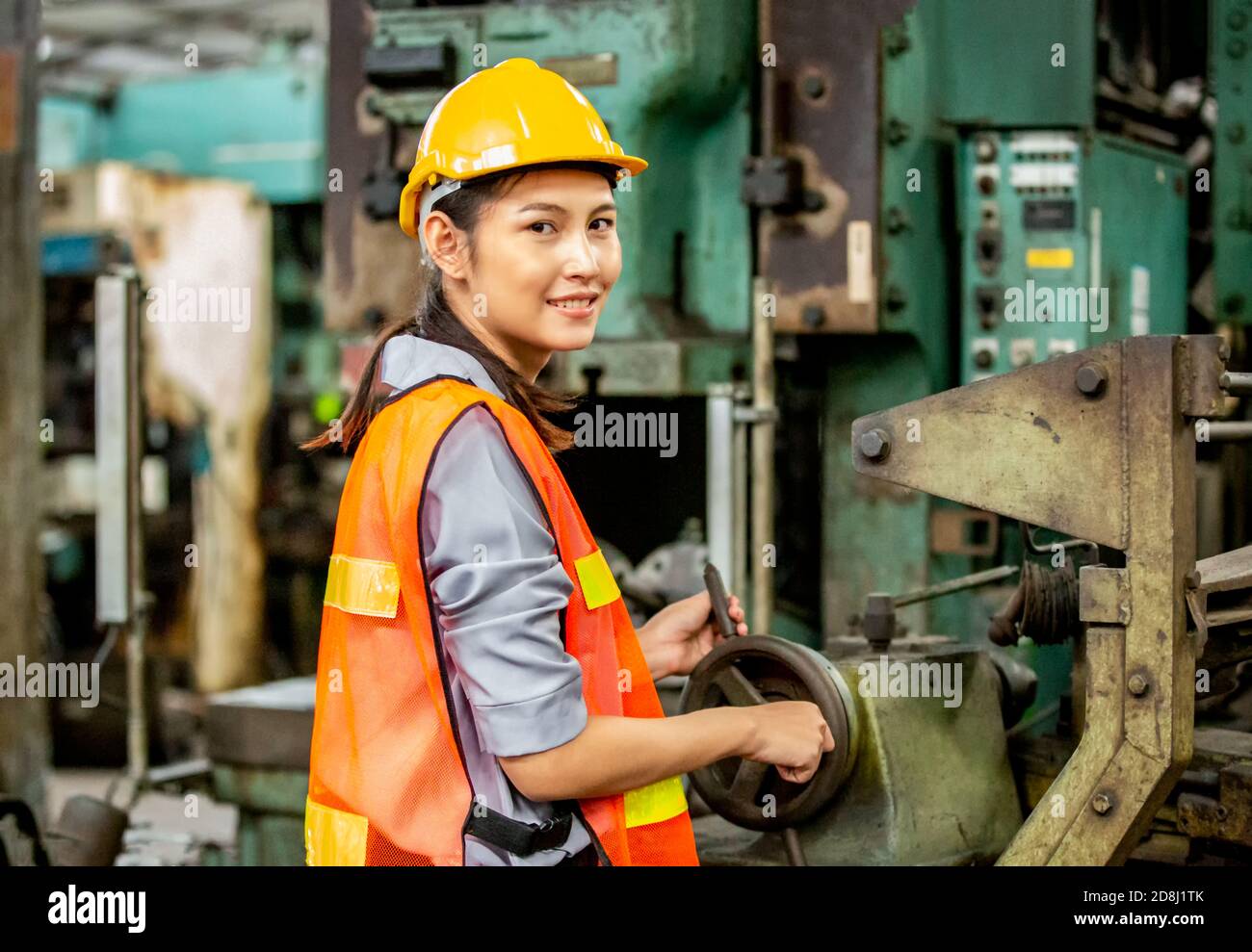 Female machine operator using digital hi-res stock photography and ...