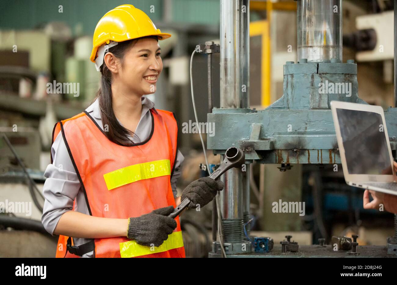 Female machine operator using digital hi-res stock photography and ...