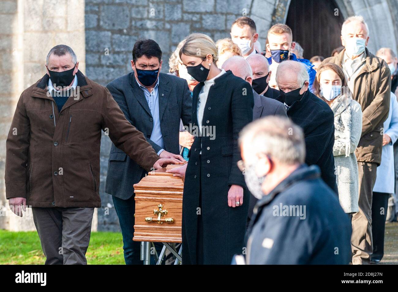 The coffins of Tadhg O'Sullivan and his son Diarmuid, leave St Mary's ...