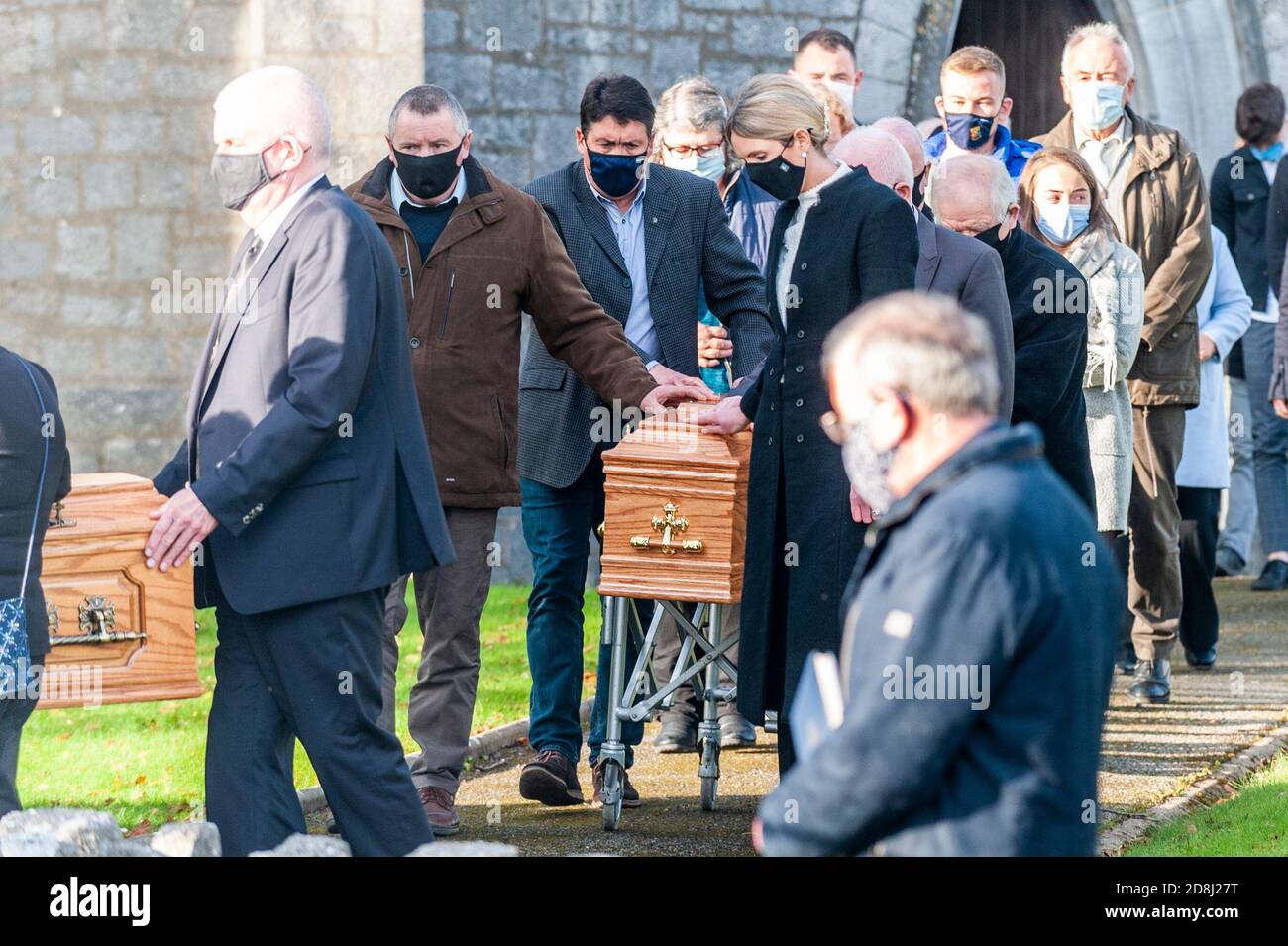 The coffins of Tadhg O'Sullivan and his son Diarmuid, leave St Mary's ...
