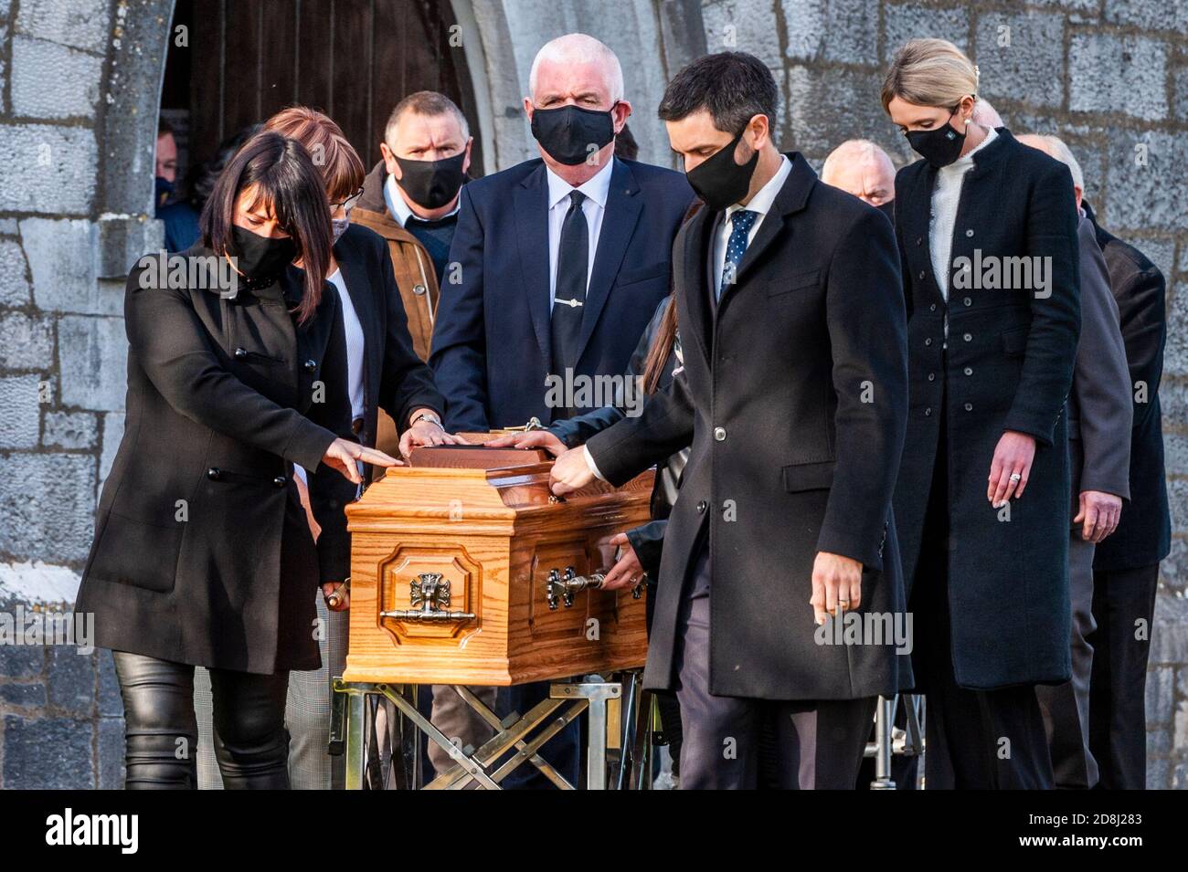 The coffins of Tadhg O'Sullivan and his son Diarmuid, leave St Mary's ...