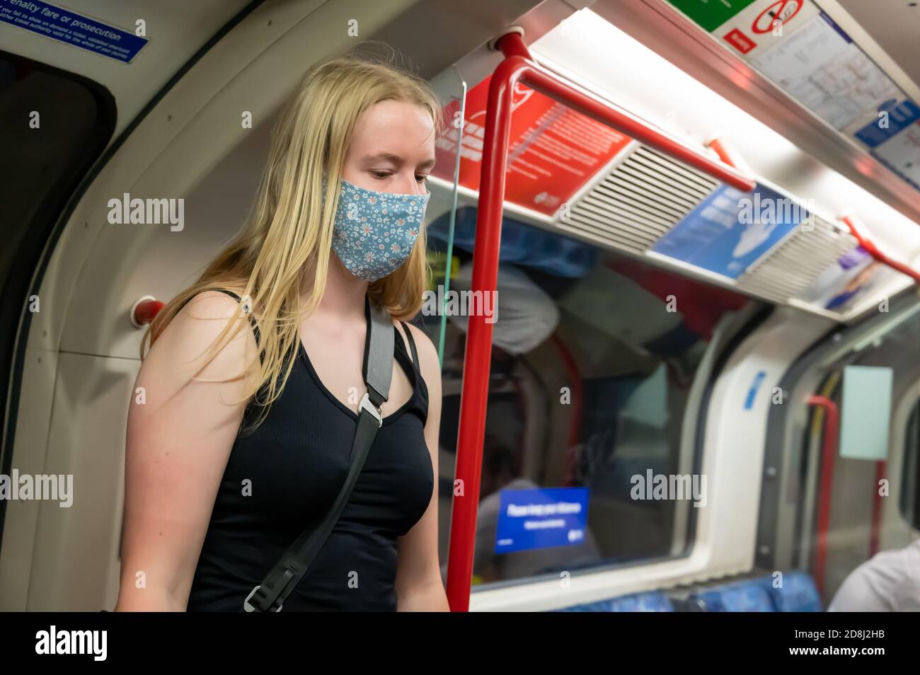 LONDON - SEPTEMBER 13, 2020: Blonde female wearing PPE face mask ...