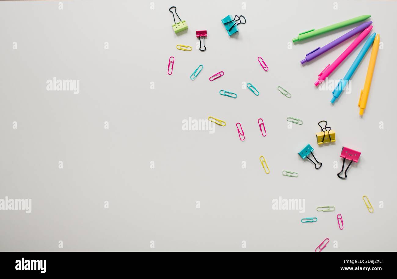 rainbow office supplies arranged on white background Stock Photo - Alamy