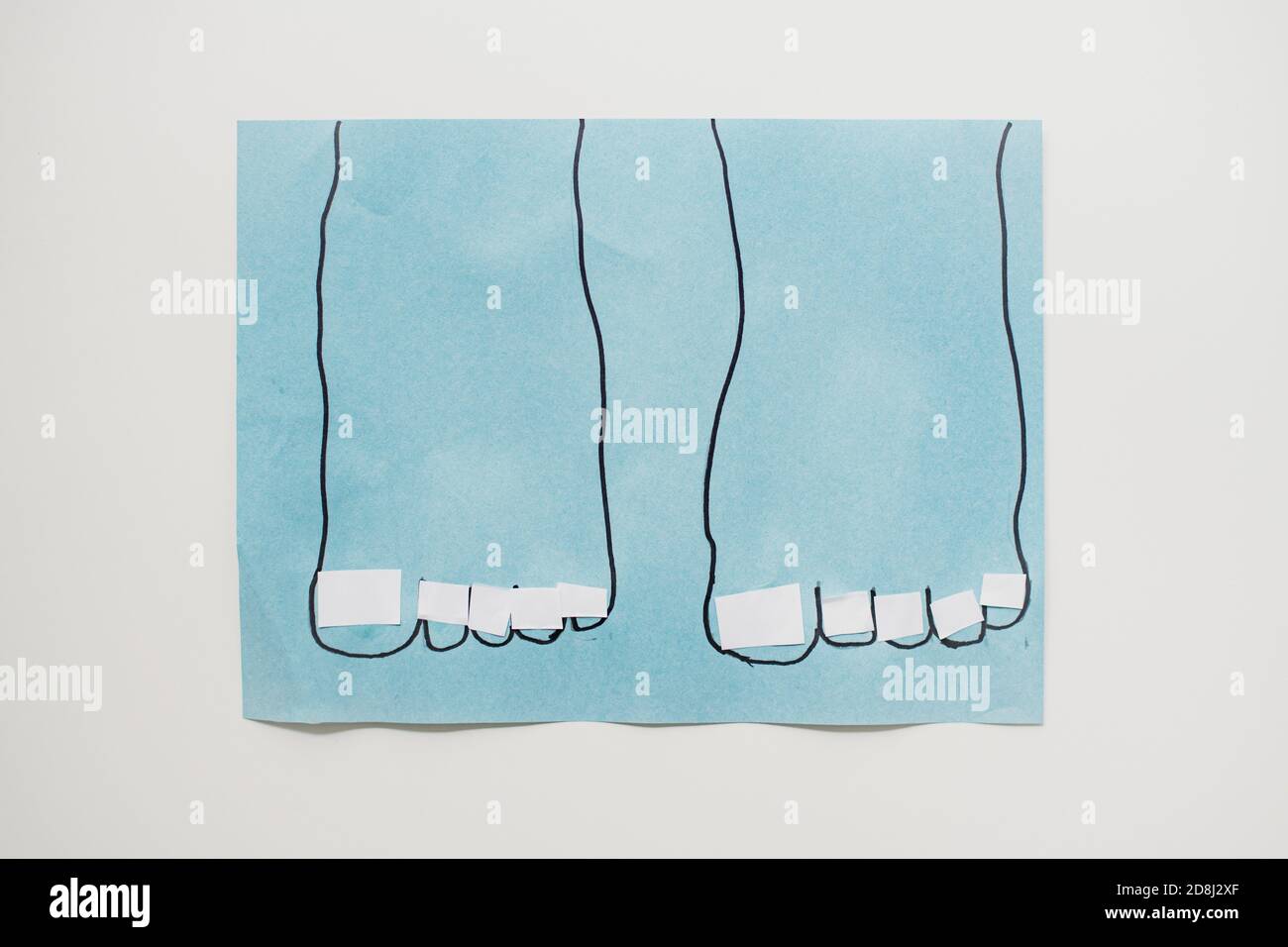 kid craft construction paper feet on white background Stock Photo - Alamy