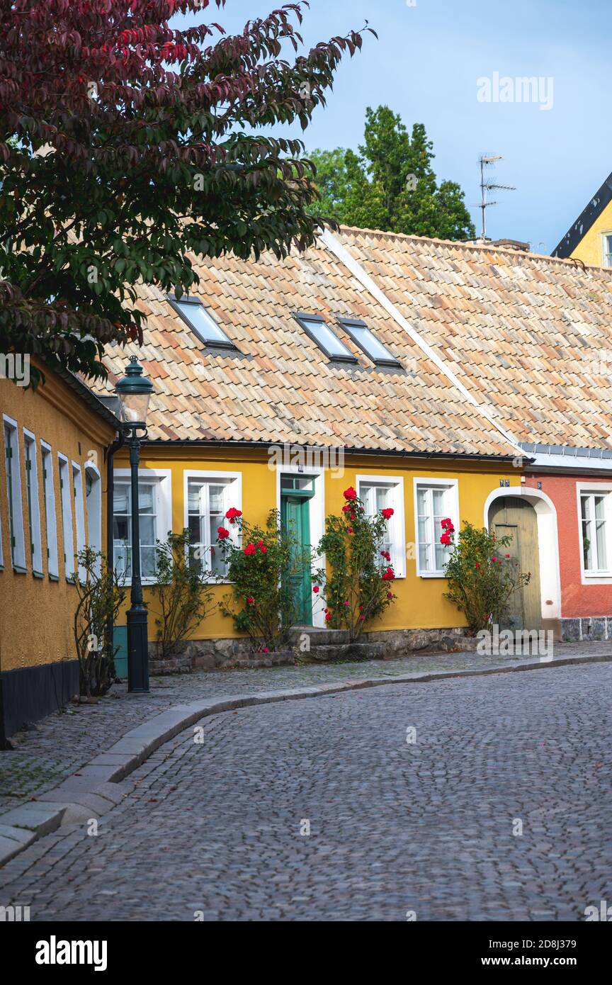 Colorful town houses along a cobblestoned street in the historic ...