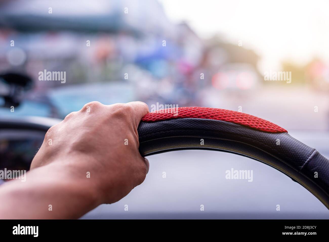 Driving concept, Hand driving a car on the road blurred background ...