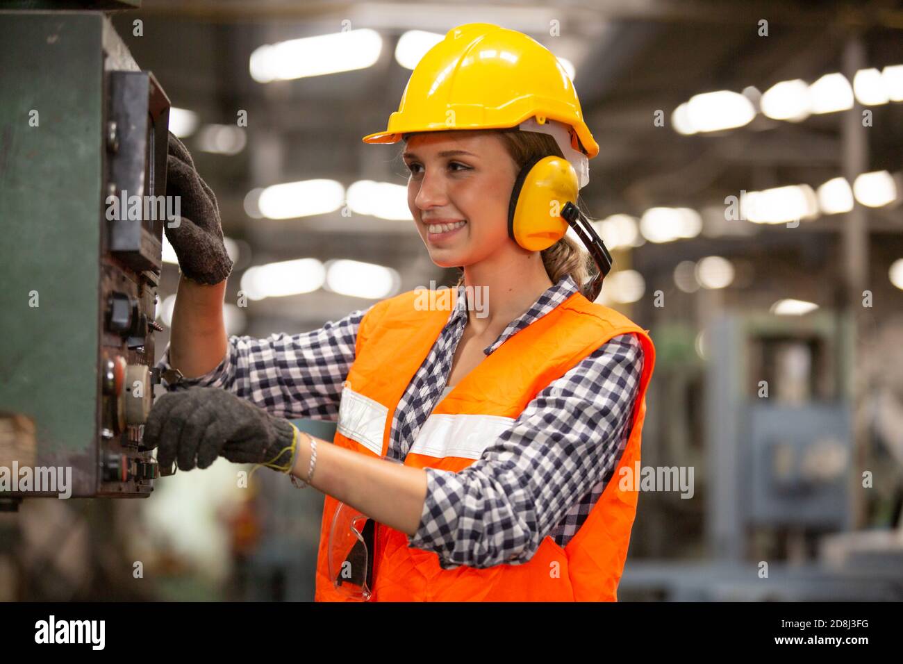 Female Engineers operating a cnc machine in factory Stock Photo - Alamy