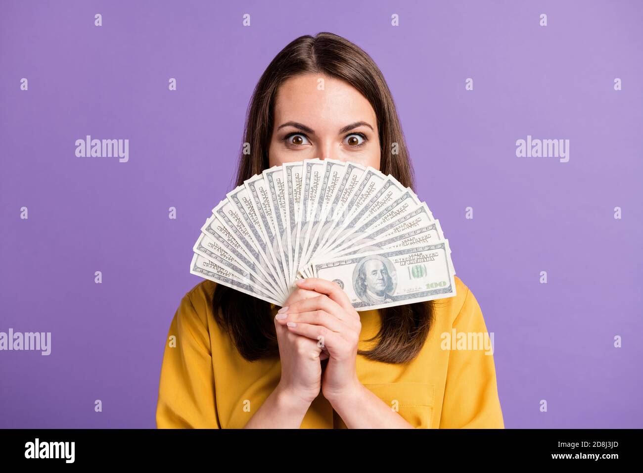 Photo of lovely young lady hold fan cash close face look camera wear ...