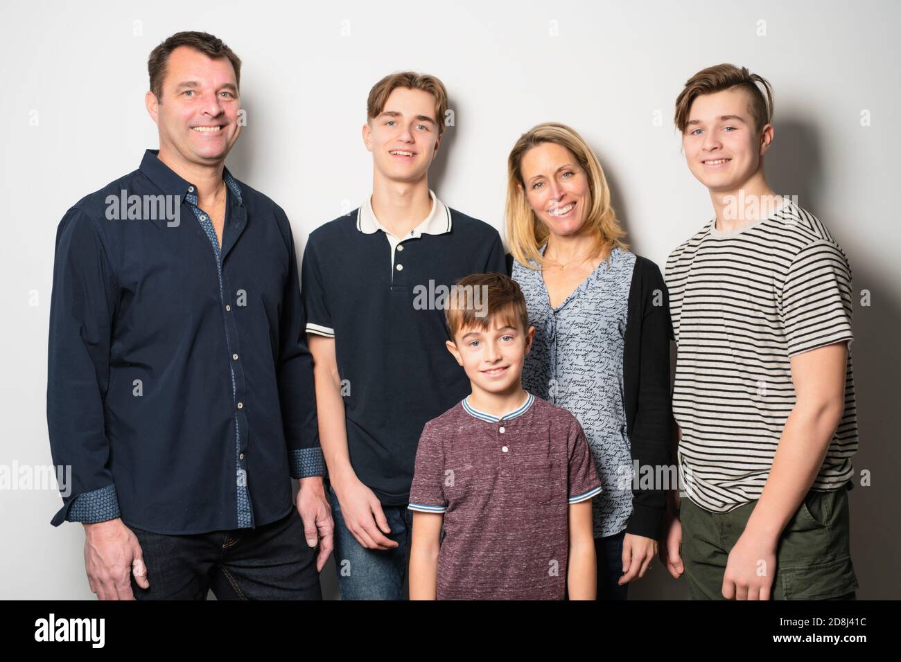 Beautiful happy family over a white background Stock Photo - Alamy