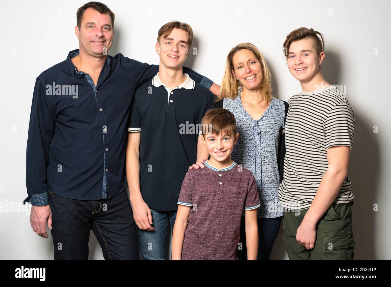 Beautiful happy family over a white background Stock Photo - Alamy