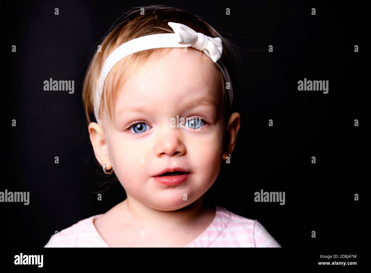 cute little girl two years old over dark background Stock Photo - Alamy