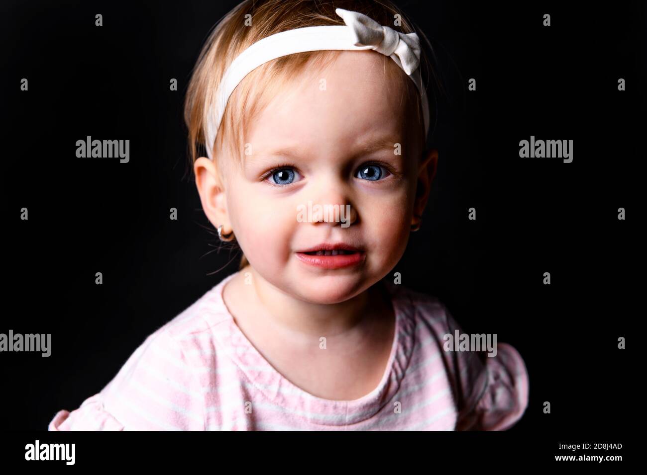 cute little girl two years old over dark background Stock Photo - Alamy