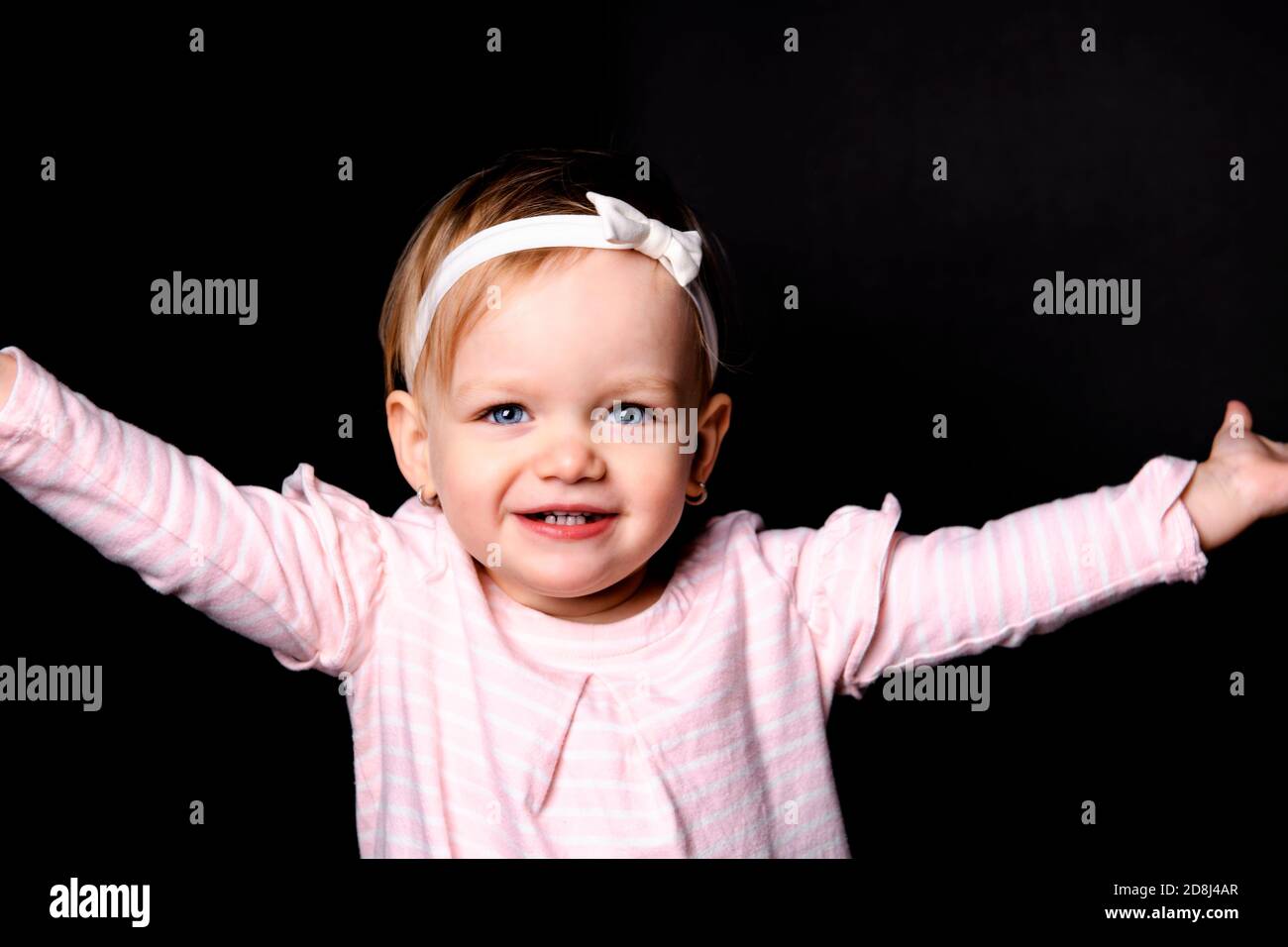 cute little girl two years old over dark background Stock Photo - Alamy