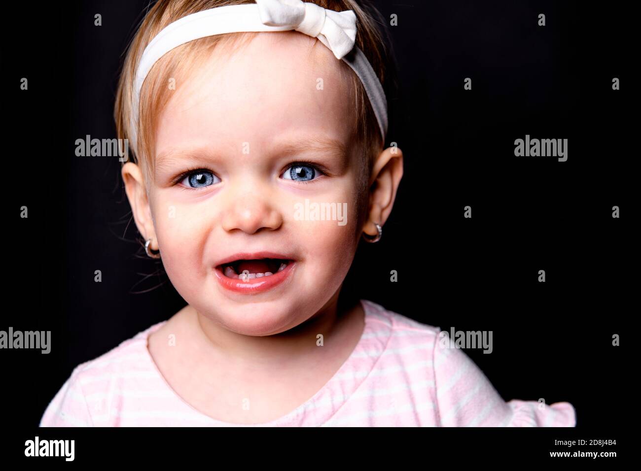 cute little girl two years old over dark background Stock Photo - Alamy