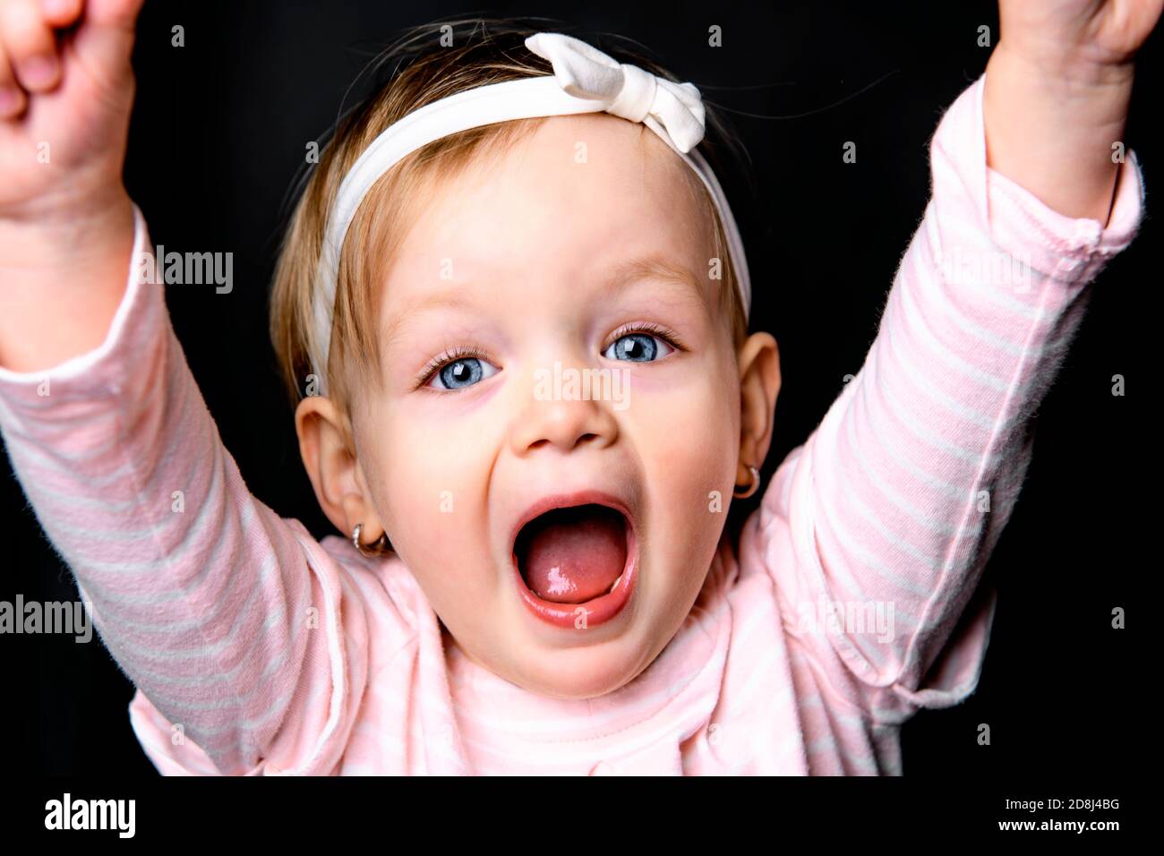 cute little girl two years old over dark background Stock Photo - Alamy