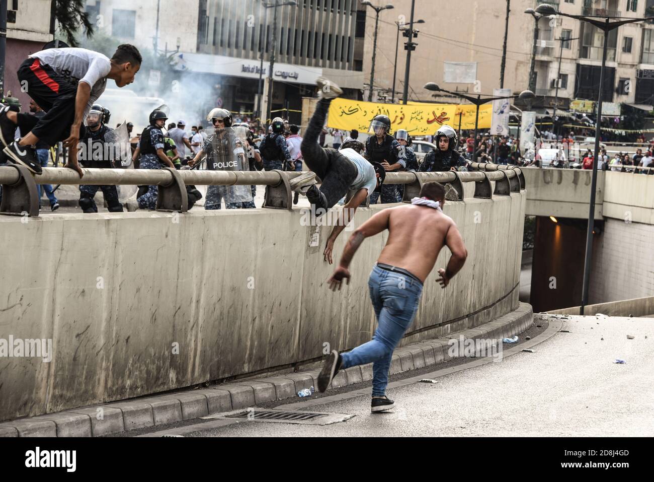 Beirut, Lebanon, 30 October 2020. Leaping a highway barrier to escape ...