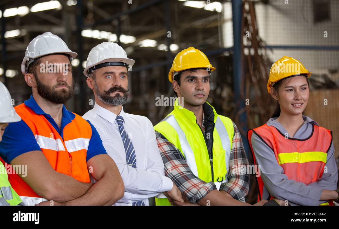 Male Industrial Engineers Talk with Factory Worker . They Work at the ...