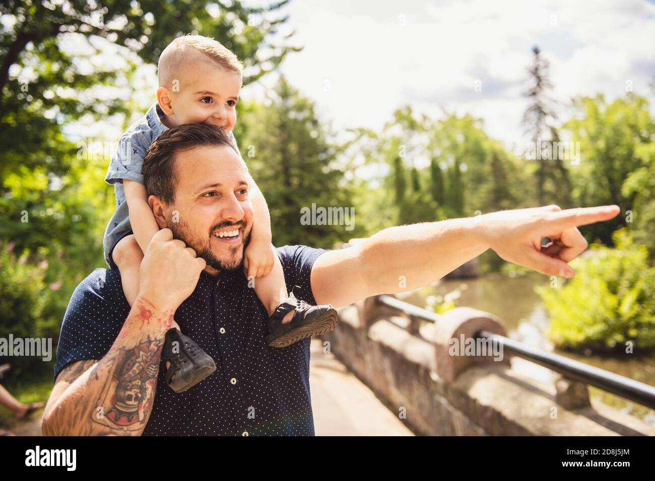 A Happy father having fun with his son on the park Stock Photo - Alamy